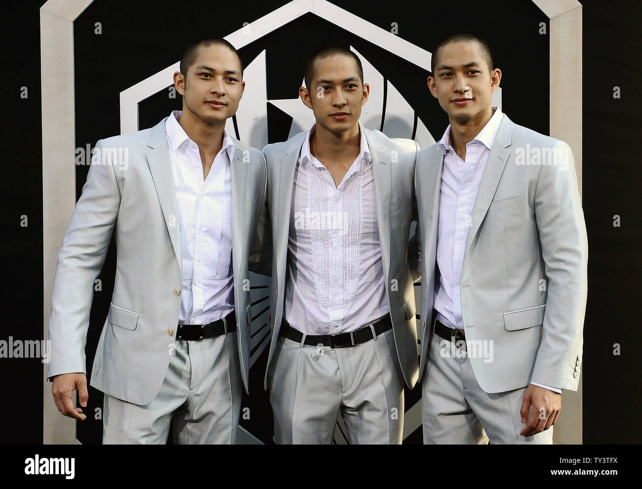The Luu triplets (R-L) Lance, Charles, and Mark arrive for the premiere ...