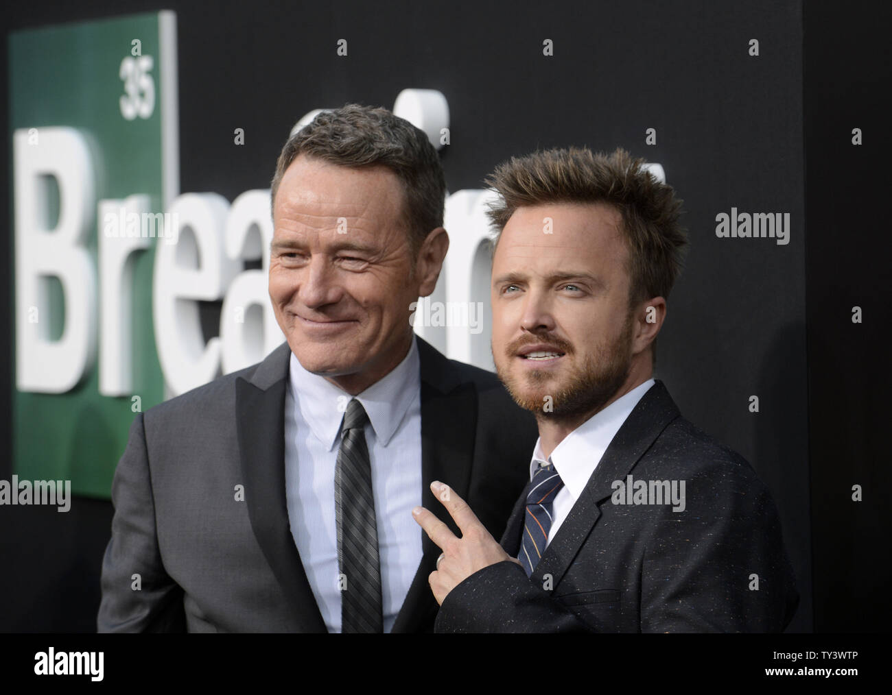 Cast members Bryan Cranston and Aaron Paul attend a premiere screening ...