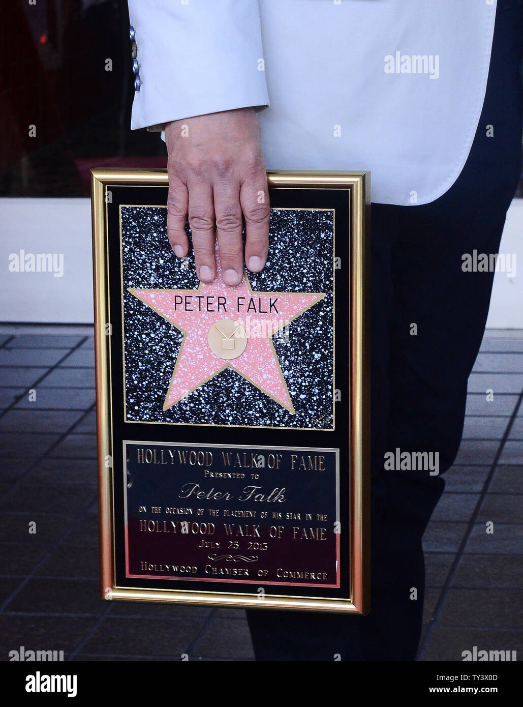 Actor Joe Mantegna holds Peter Falk's replica plaque, who received a ...