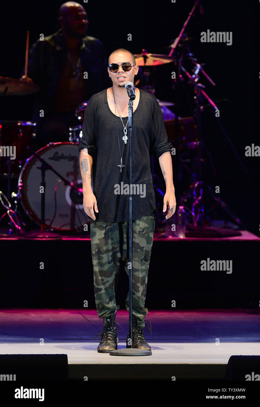 Evan Ross, the son of singer Diana Ross performs before his mother ...