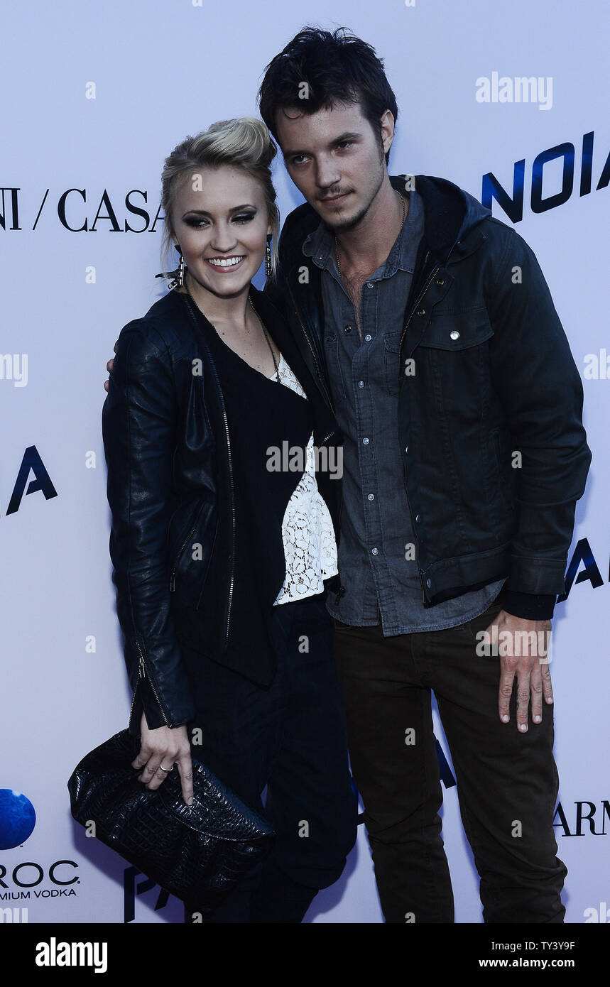Actress Emily Osment and actor Nathan Keyes attend the premiere of the ...