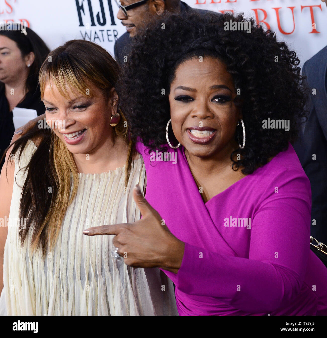 Cast member Oprah Winfrey (R) poses with costume designer Ruth E ...