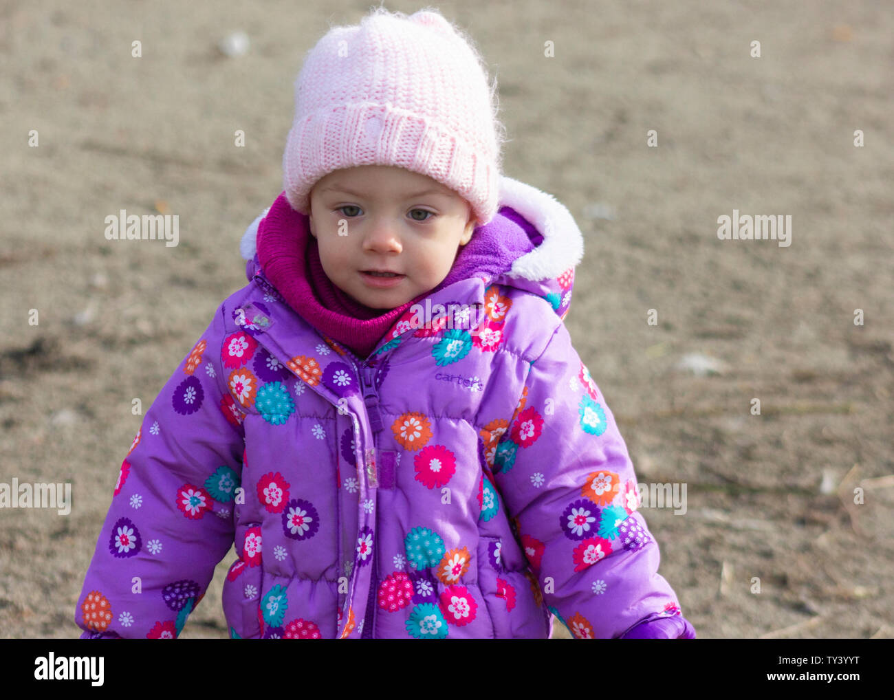 21 months old baby enjoying the nice weather outside. Toddler girl ...