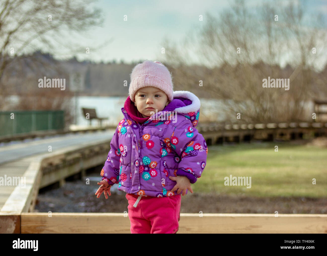 21 months old baby enjoying the nice weather outside. Toddler girl ...