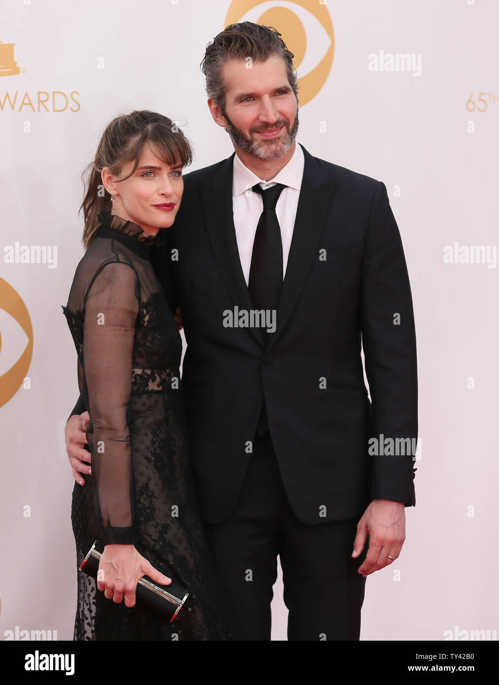 Actress Amanda Peet (L) and producer David Benioff arrive for the 65th ...