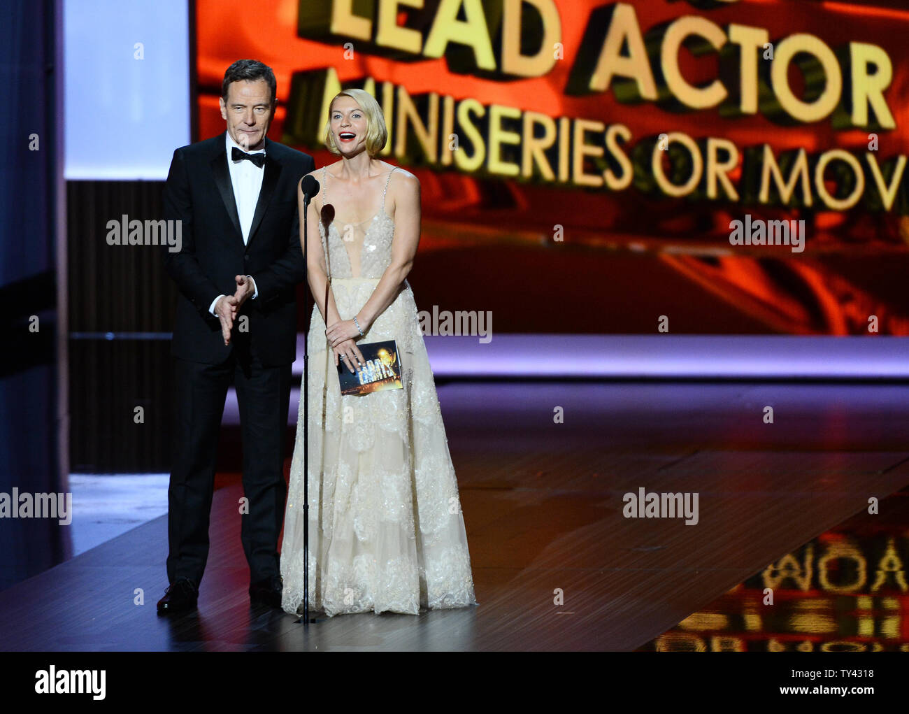 Actor Bryan Cranston (L) and actress Claire Danes speak onstage during ...