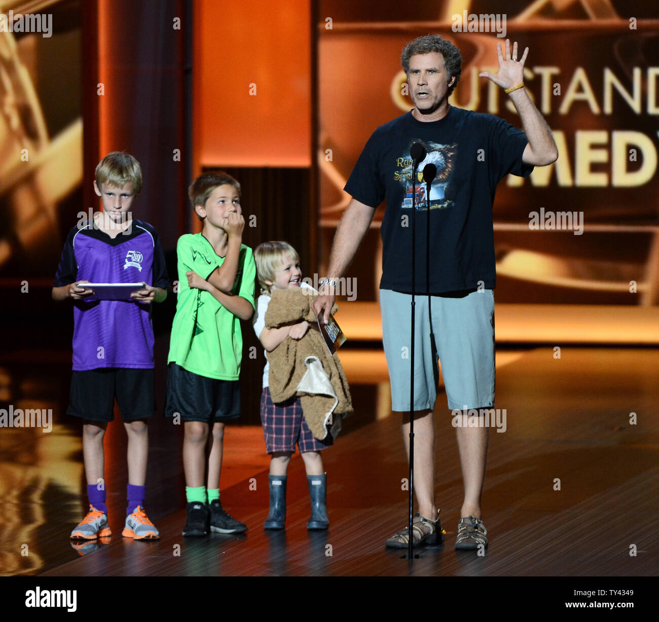 Presenter Will Ferrell takes the stage with his sons Magnus, 9, Mattias ...