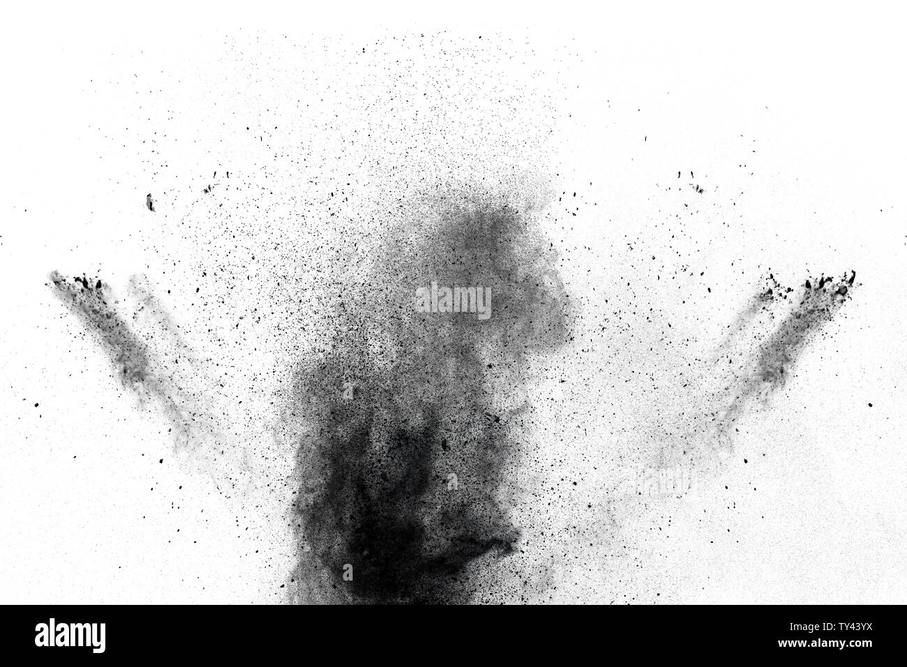 Black particles splattered on white background. Black powder dust ...