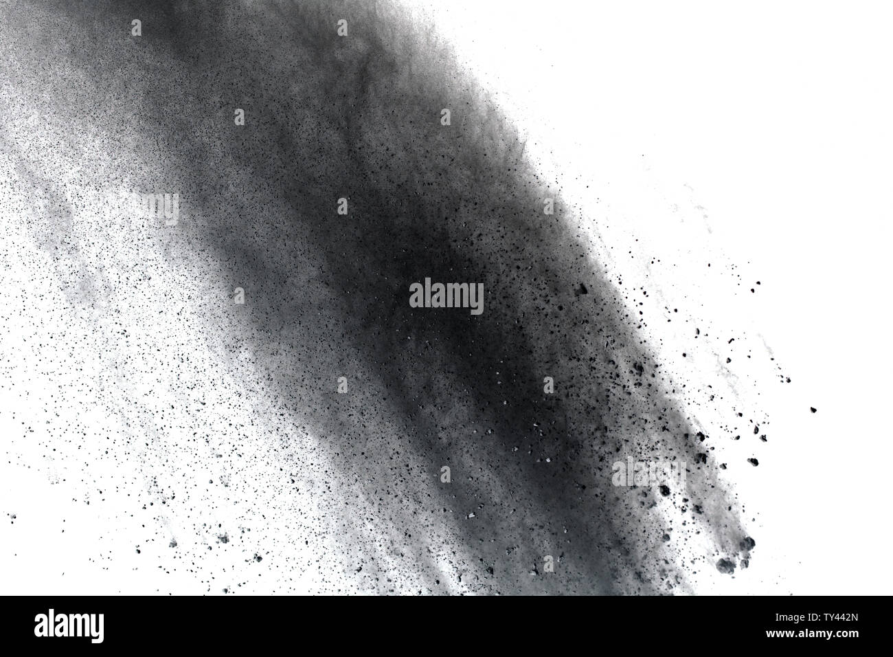 Black particles splattered on white background. Black powder dust ...