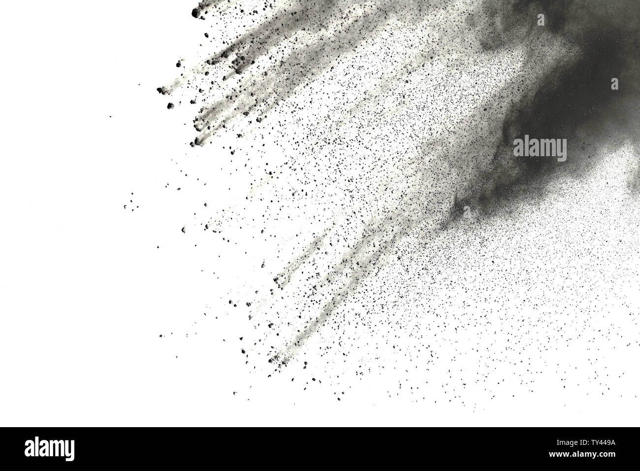 Black particles splattered on white background. Black powder dust ...