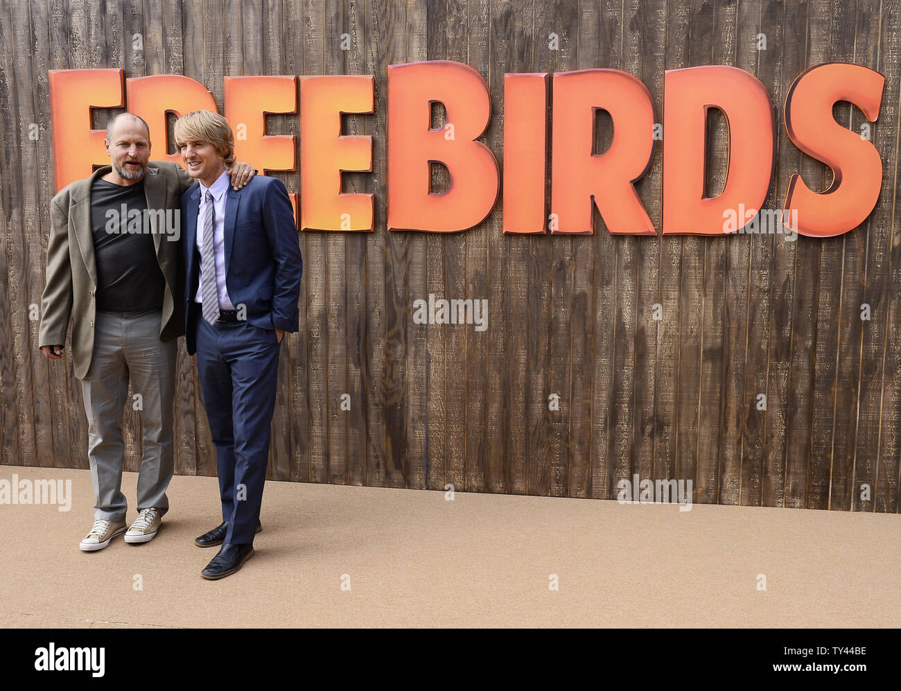 Cast members Woody Harrelson (L), the voice of Jake and Owen Wilson ...