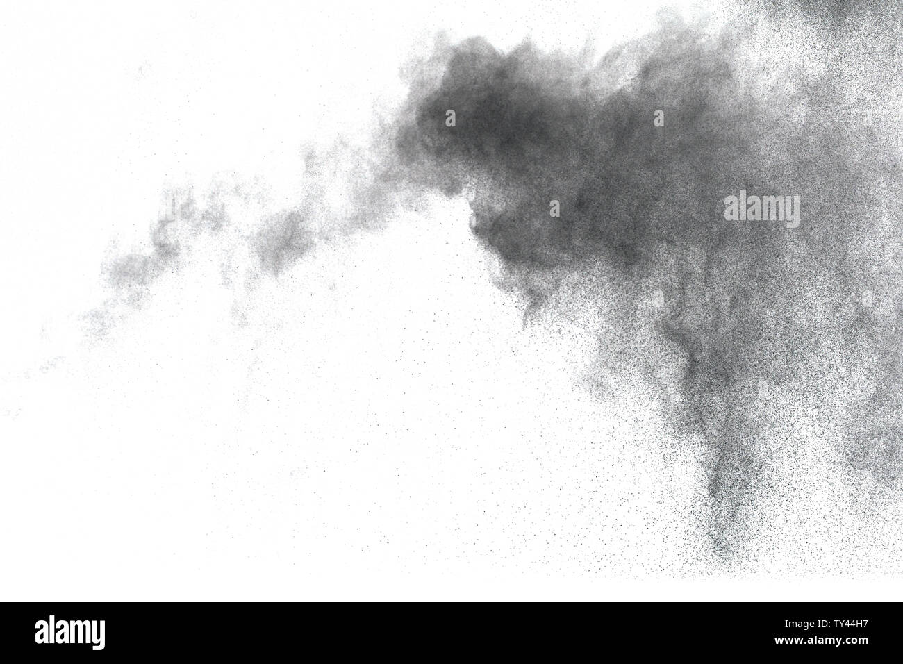 Black particles splattered on white background. Black powder dust ...