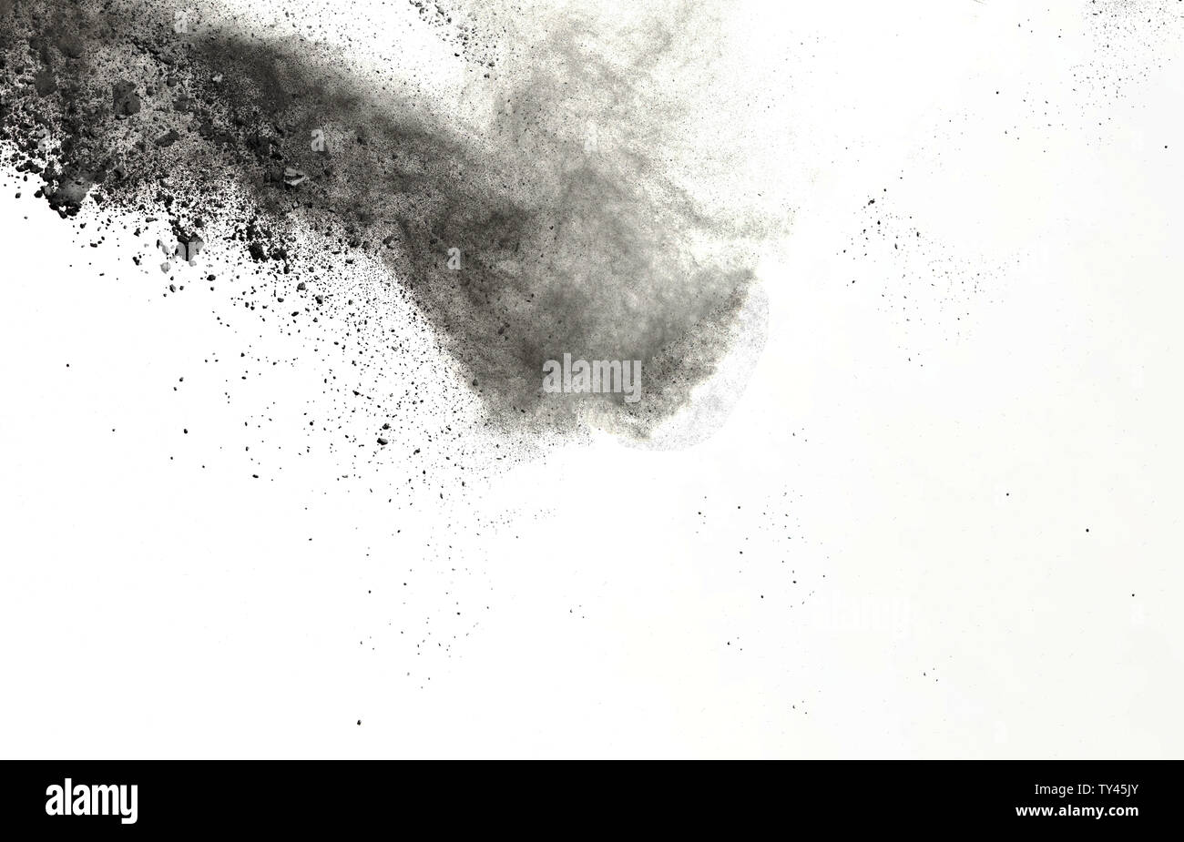 Black particles splattered on white background. Black powder dust ...