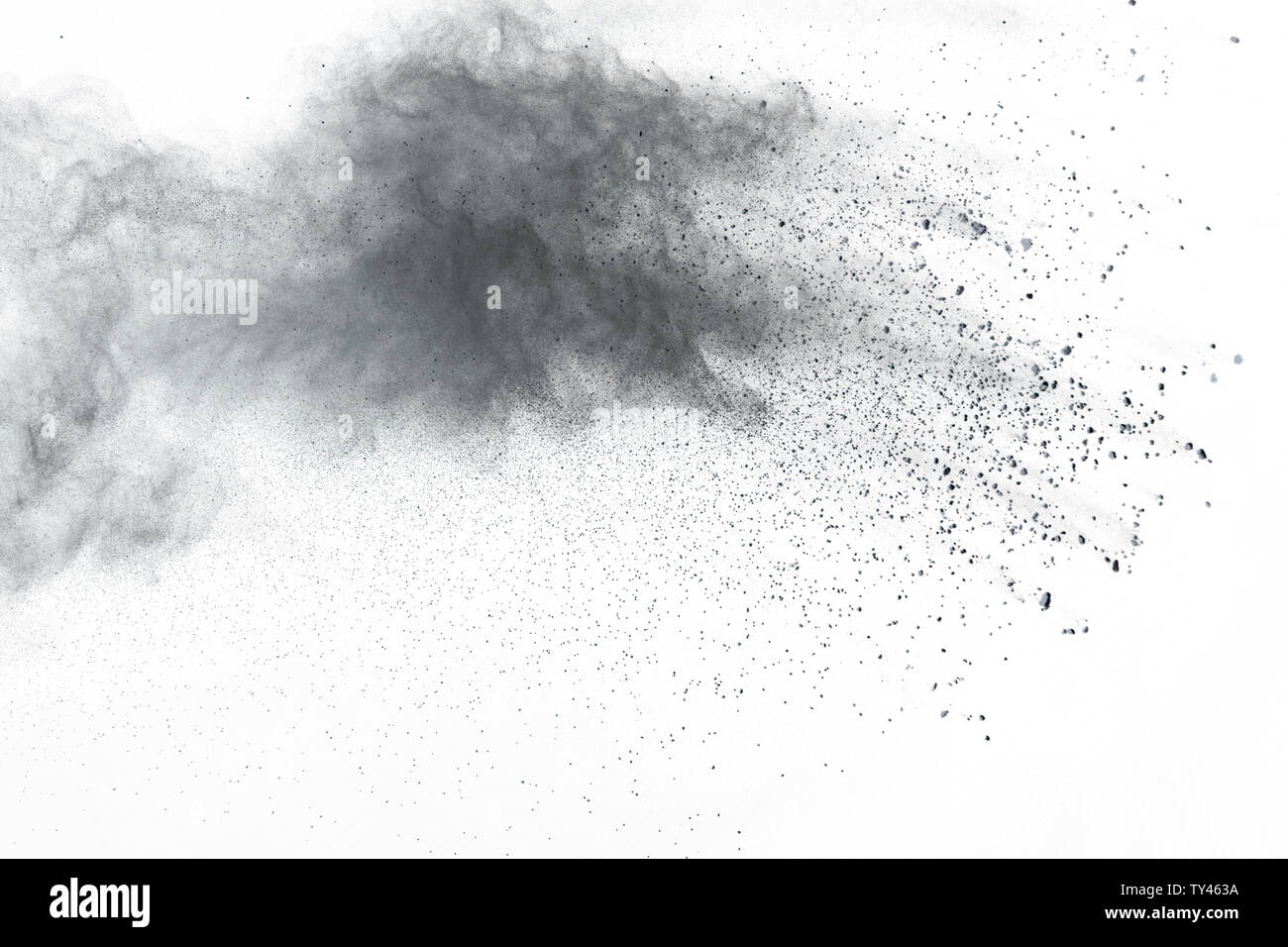 Black particles splattered on white background. Black powder dust ...