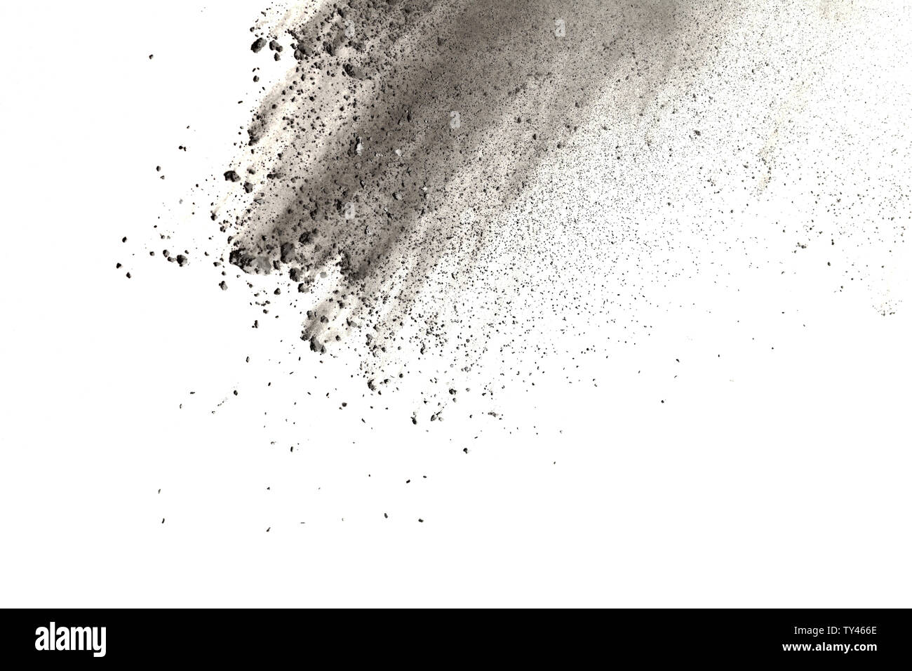 Black particles splattered on white background. Black powder dust ...