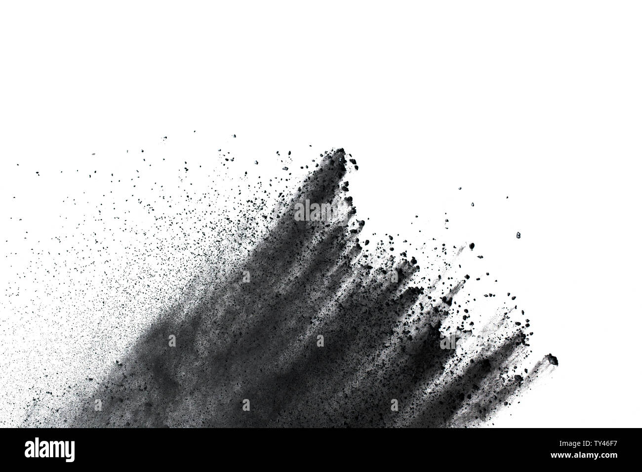 Black particles splattered on white background. Black powder dust ...
