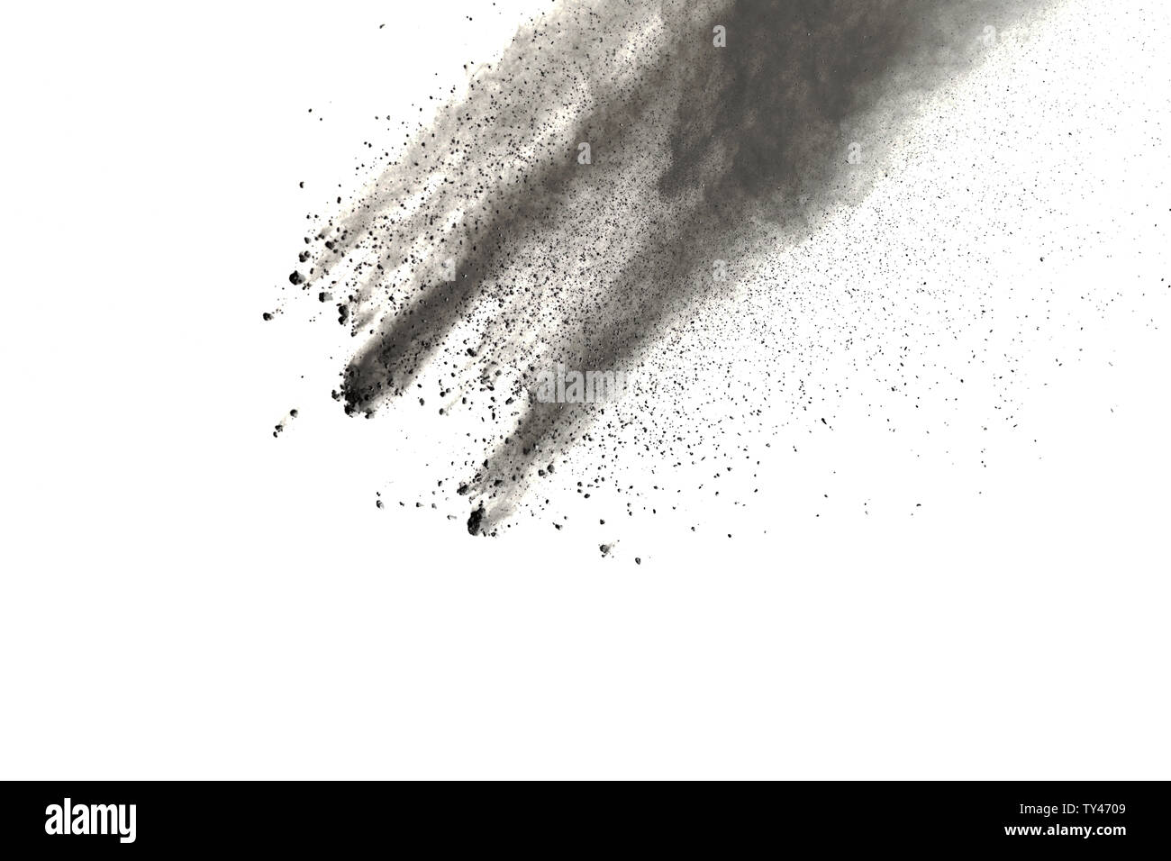 Black particles splattered on white background. Black powder dust ...