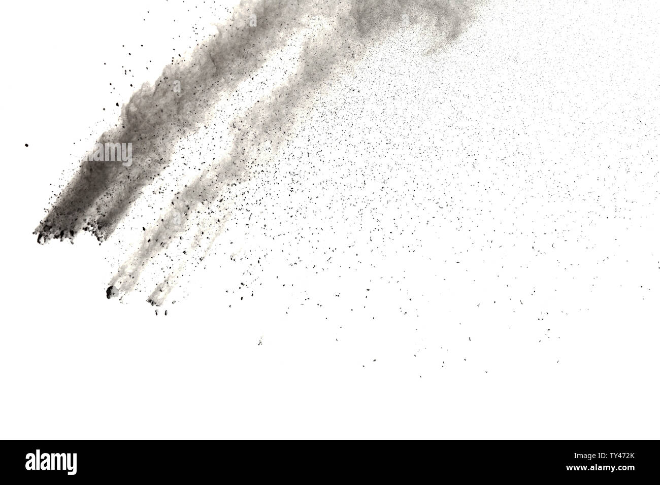 Black particles splattered on white background. Black powder dust ...