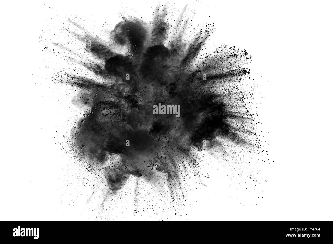 Black particles splattered on white background. Black powder dust ...