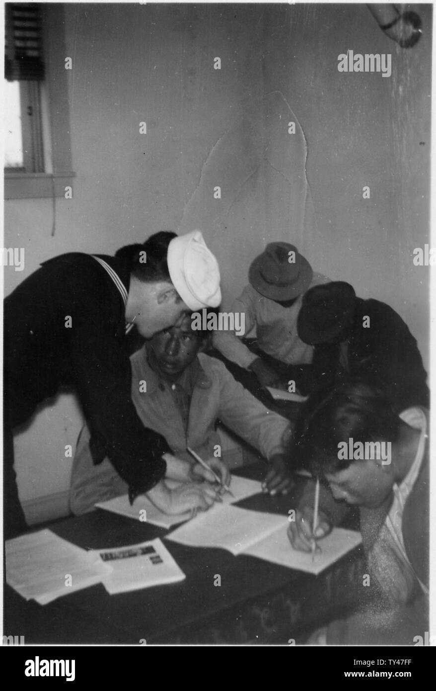 Filling out forms for enlistment in the Navy Stock Photo - Alamy