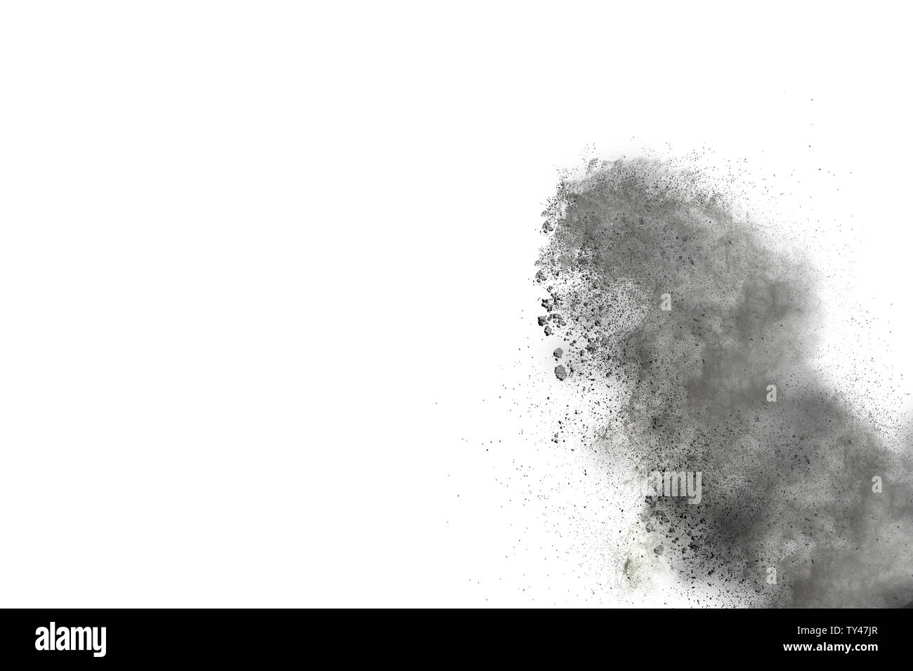Black particles splattered on white background. Black powder dust ...