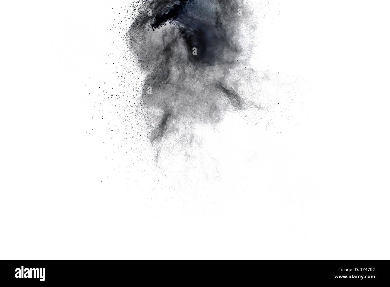 Black particles splattered on white background. Black powder dust ...