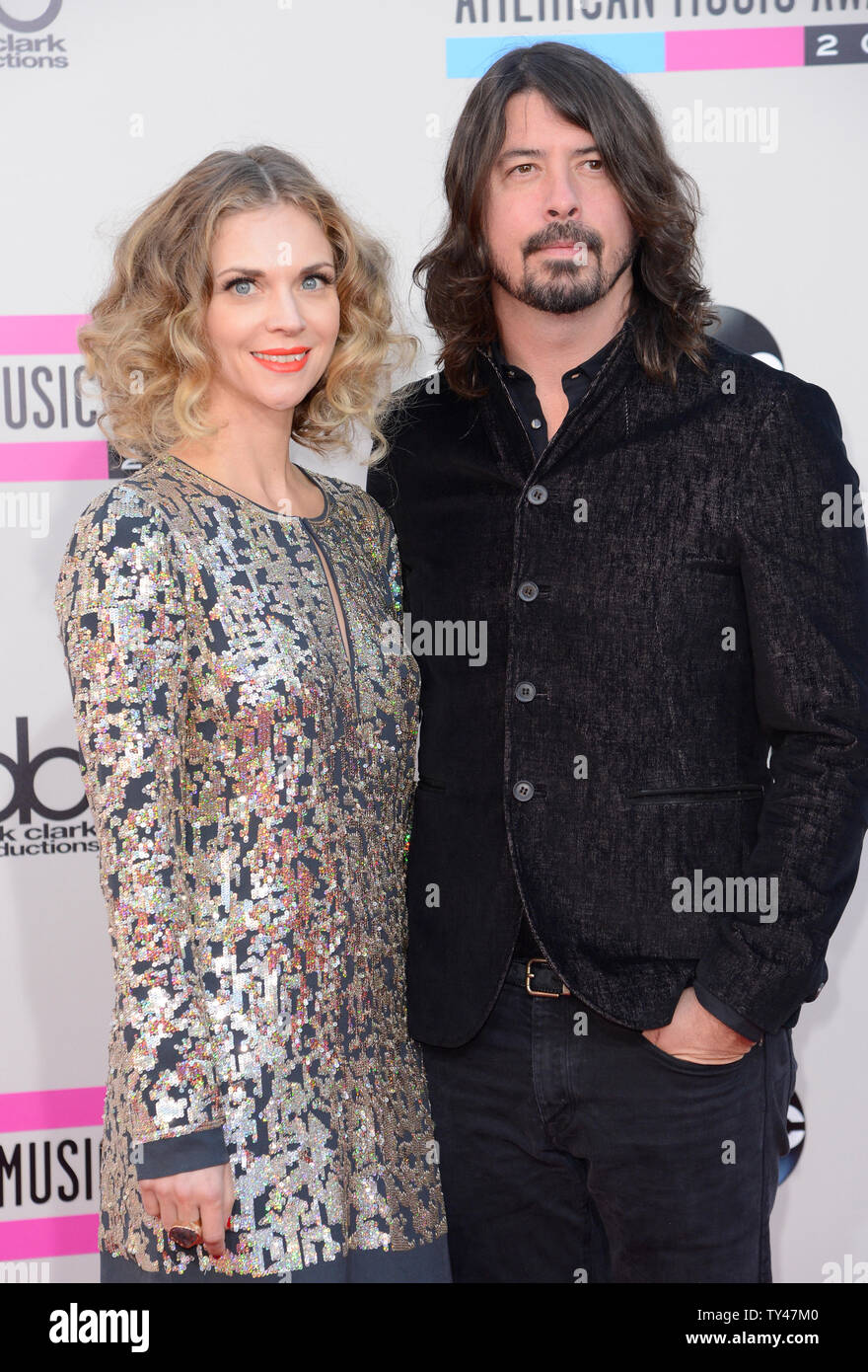 Jordyn Blum (L) and recording artist Dave Grohl arrive for the 41st ...