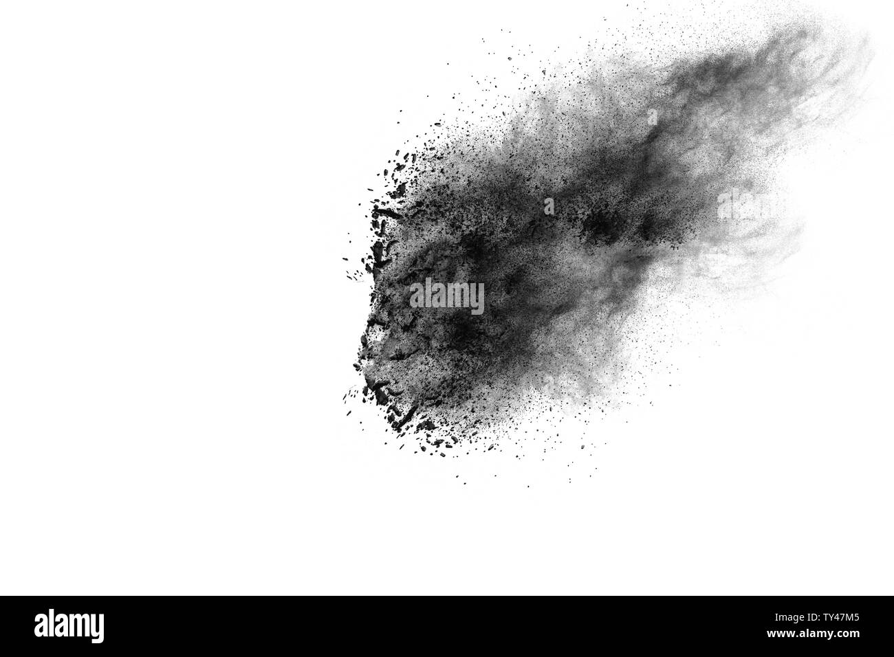 Black particles splattered on white background. Black powder dust ...