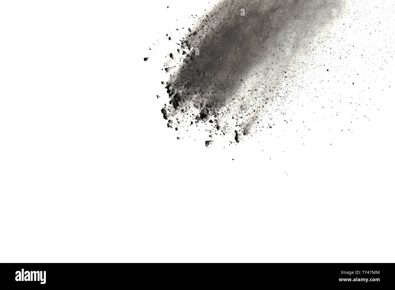 Black particles splattered on white background. Black powder dust ...