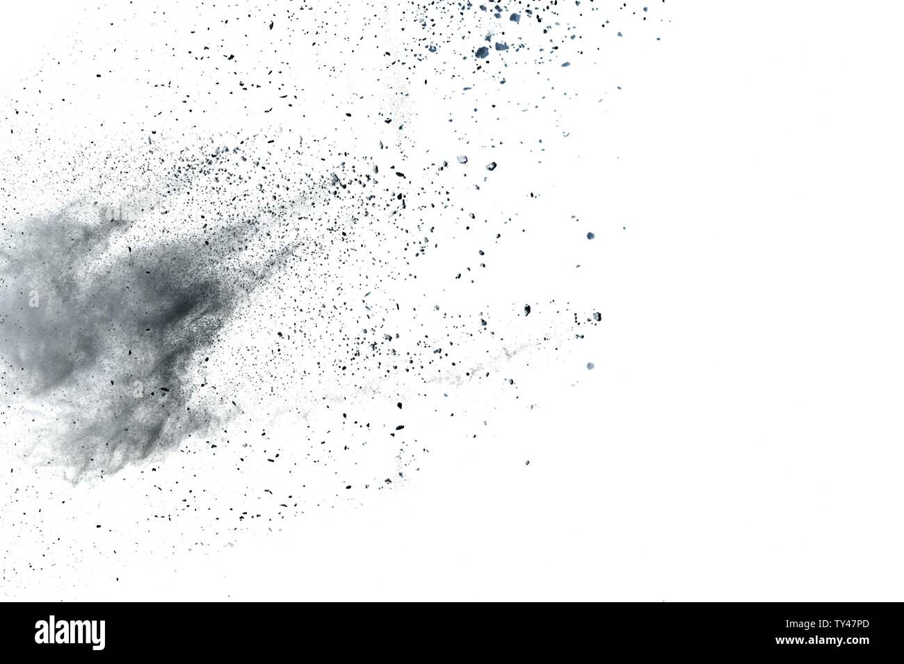 Black particles splattered on white background. Black powder dust ...
