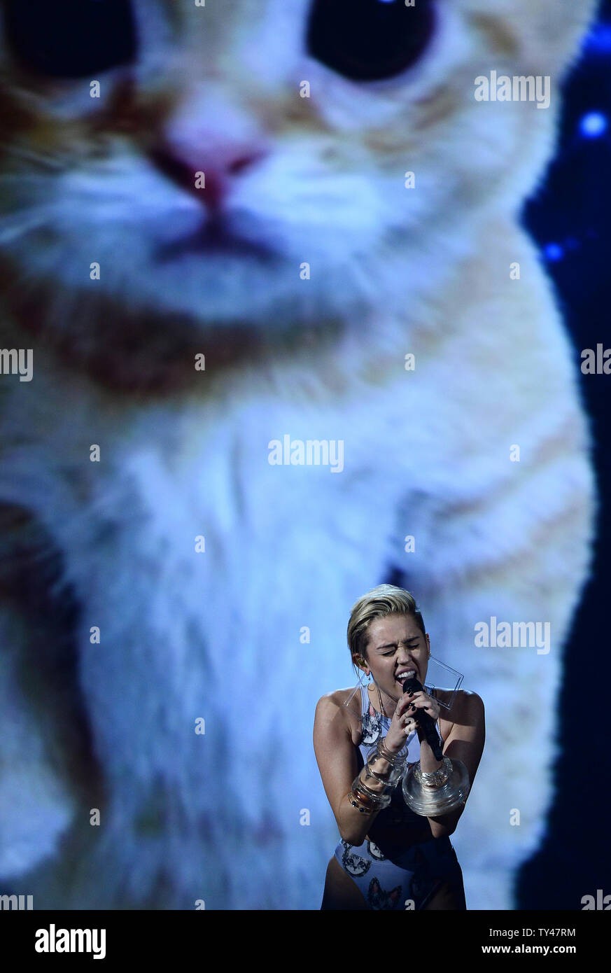 Singer Miley Cyrus sings "Wrecking Ball" at the 41st annual American ...