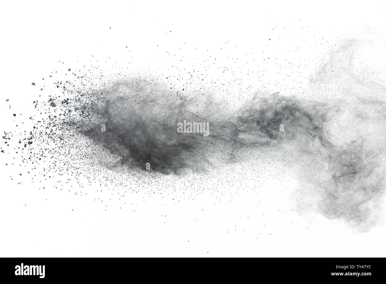 Black particles splattered on white background. Black powder dust ...
