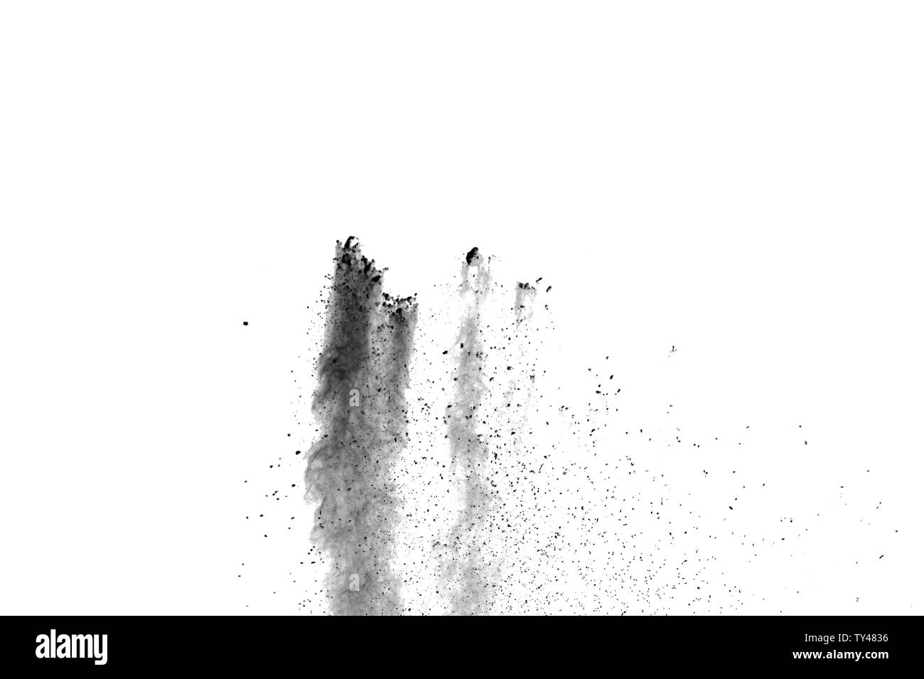 Black particles splattered on white background. Black powder dust ...