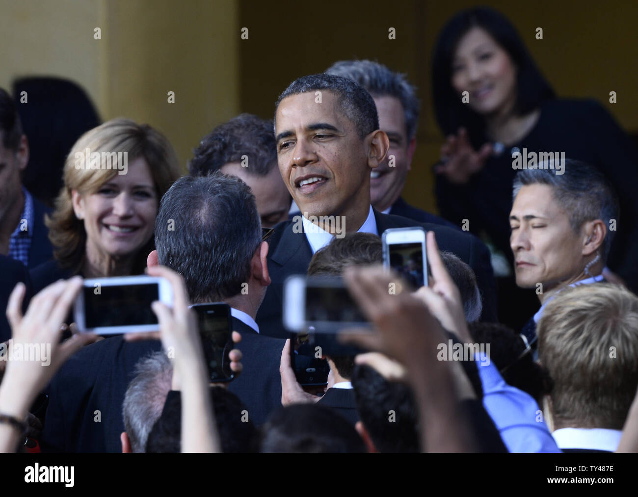 President Barack Obama shakes hands after addressing a crowd of 2,000 ...