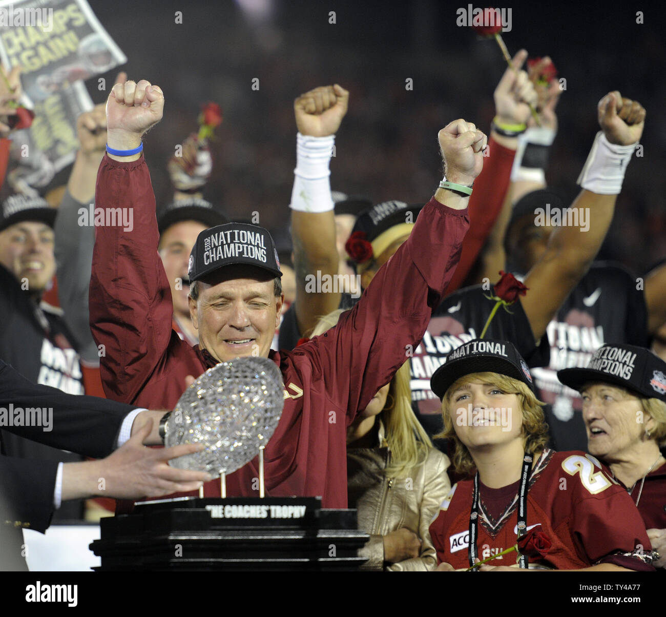Florida State head coach Jimbo Fisher looks at the trophy after beating ...