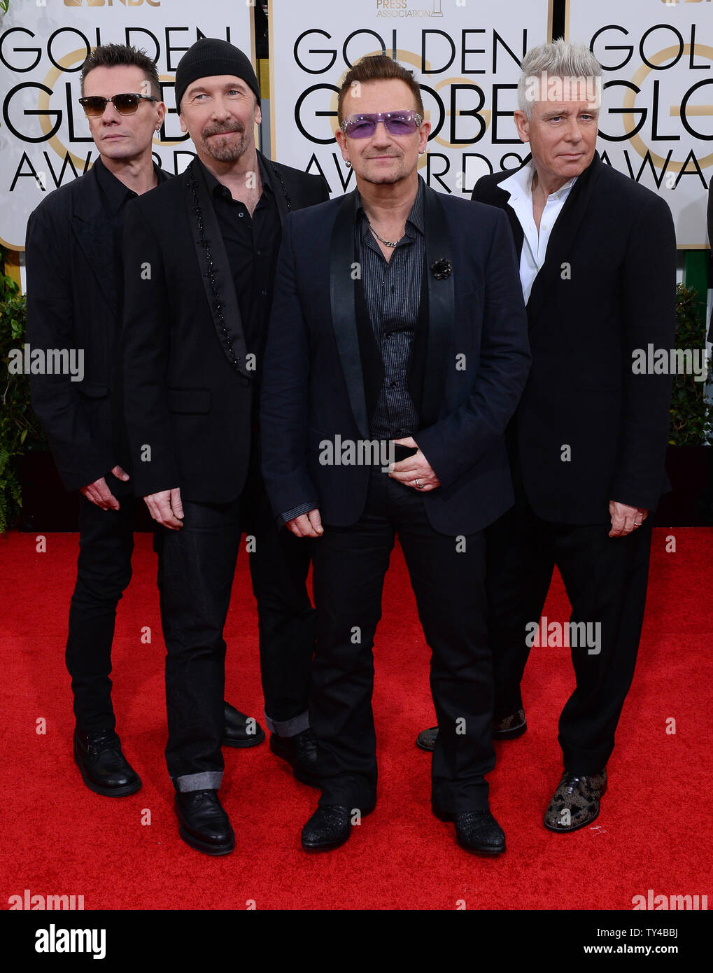 Members of the rock group U2 Larry Mullen Jr., The Edge, Bono, and Adam ...