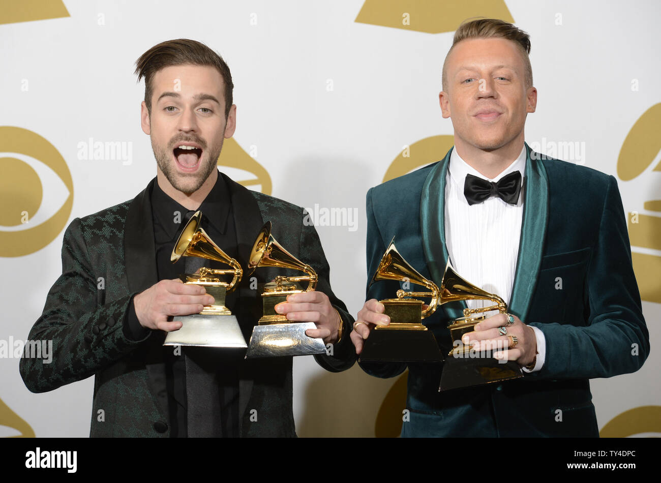 Macklemore & Ryan Lewis hold the four Grammy Awards they won including ...