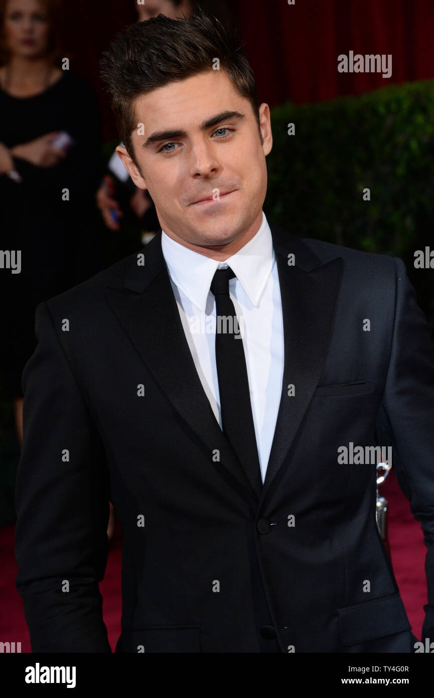 Actor Zac Efron arrives on the red carpet at the 86th Academy Awards at ...