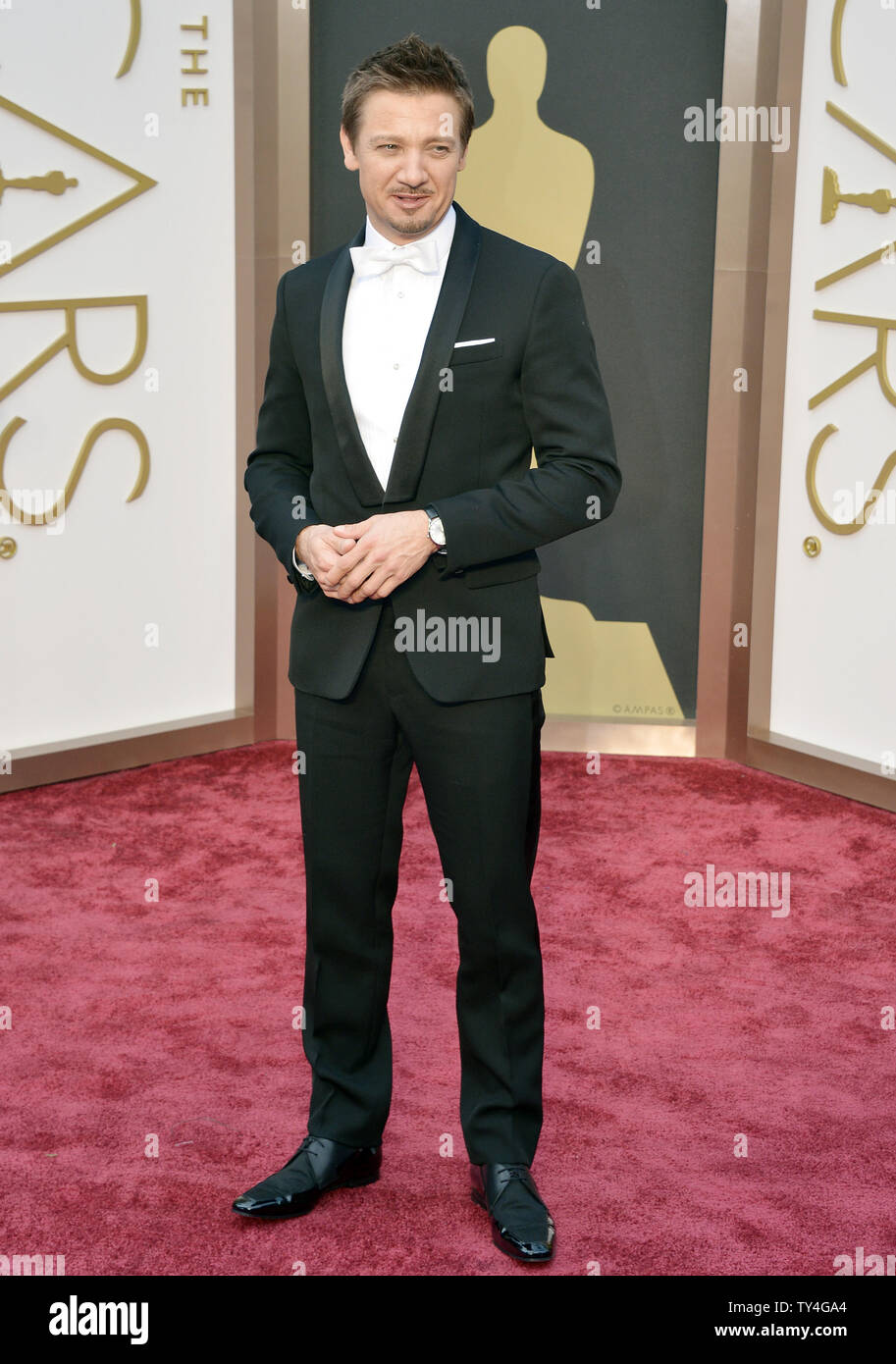 Jeremy Renner arrives on the red carpet at the 86th Academy Awards at ...