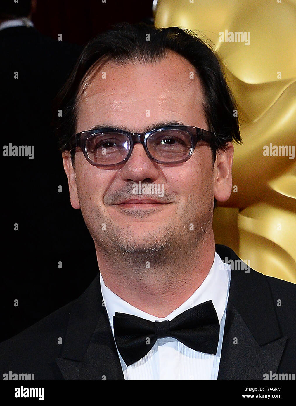 Editor Joe Walker arrives on the red carpet at the 86th Academy Awards ...