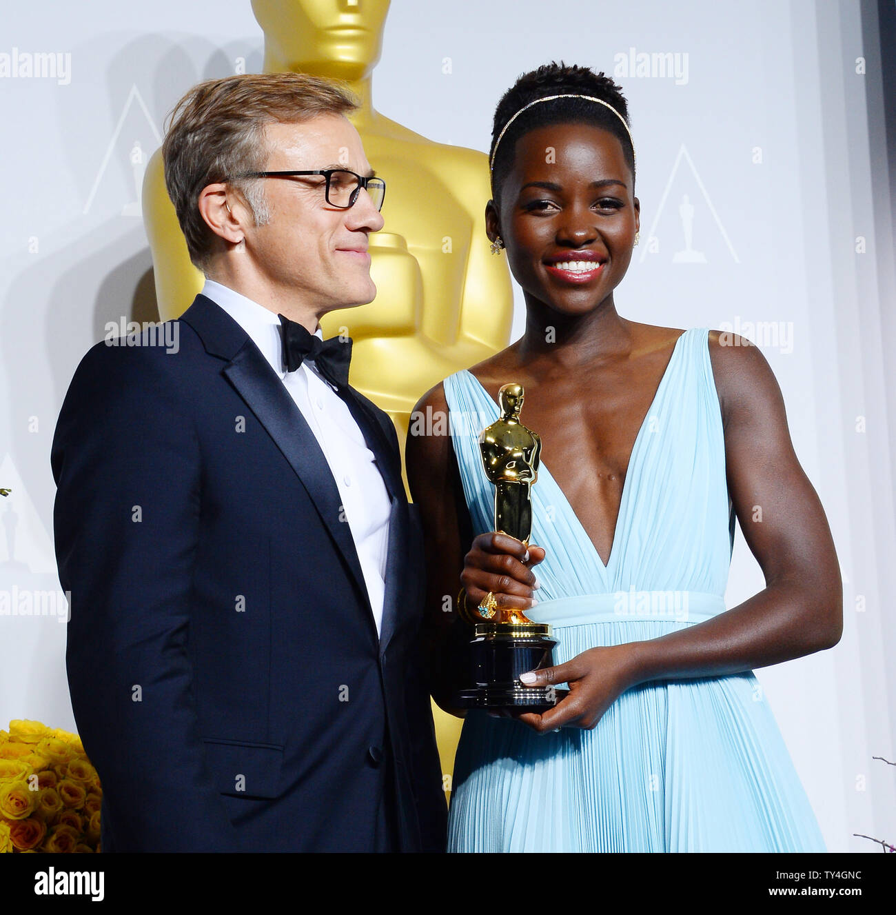 Actor Christoph Waltz (L) and actress Lupita Nyong'o holds the award ...