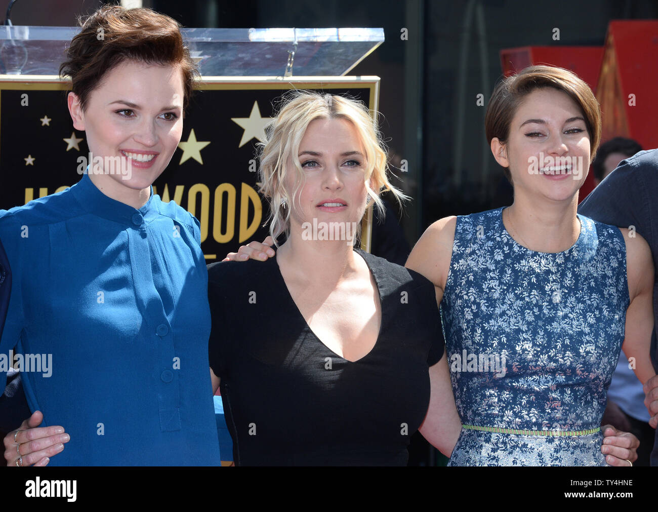 Actresses Kate Winslet (C) and Shailene Woodley pose with author ...