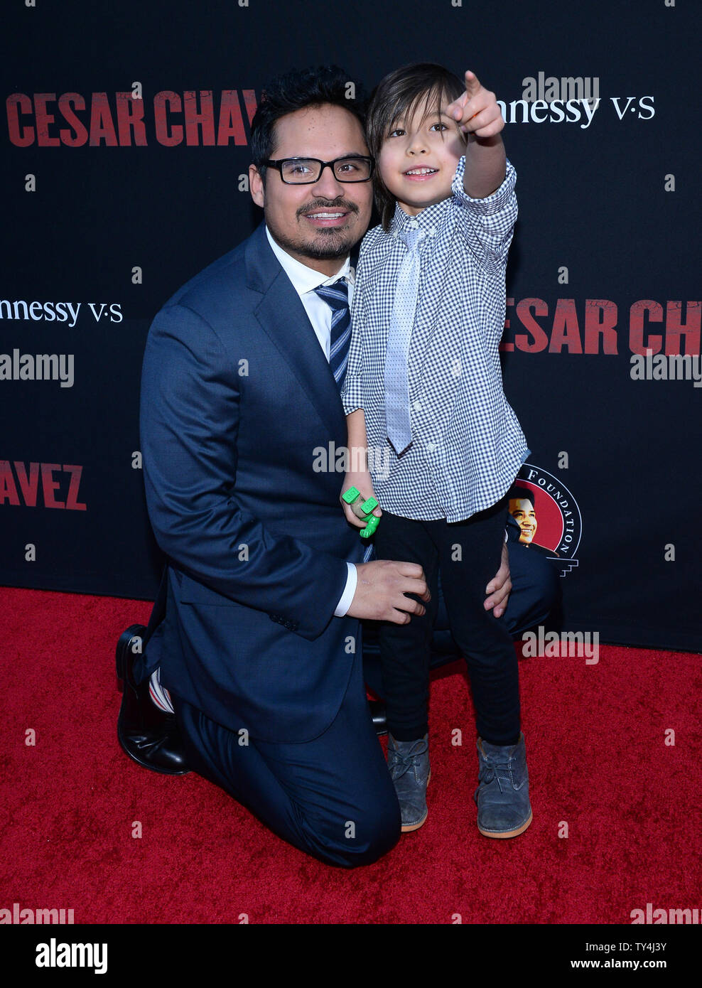 Cast member Michael Pena (L) and his son Roman attend the premiere of ...