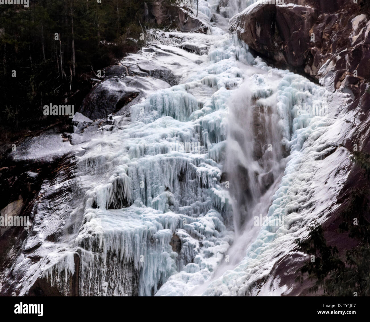 Beautiful, colorful frozen waterfall.Stunning winter scene. Awesome ...