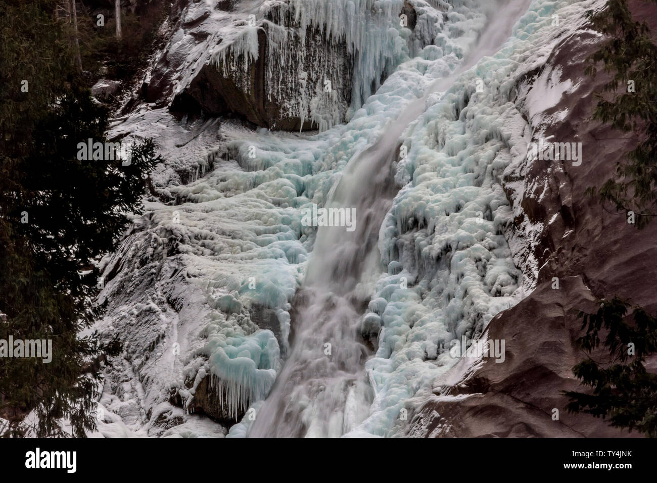 Beautiful, colorful frozen waterfall.Stunning winter scene. Awesome ...