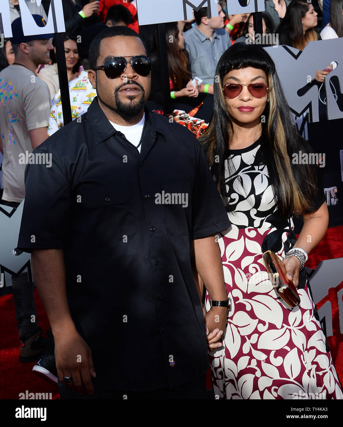 Actor/recording artist Ice Cube (L) and Kimberly Woodruff arrive for ...