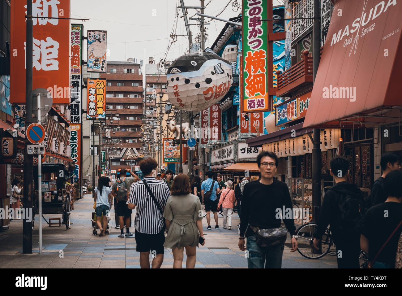 Osaka, Japan, June 18, 2019 : people walking on the shopping street at ...