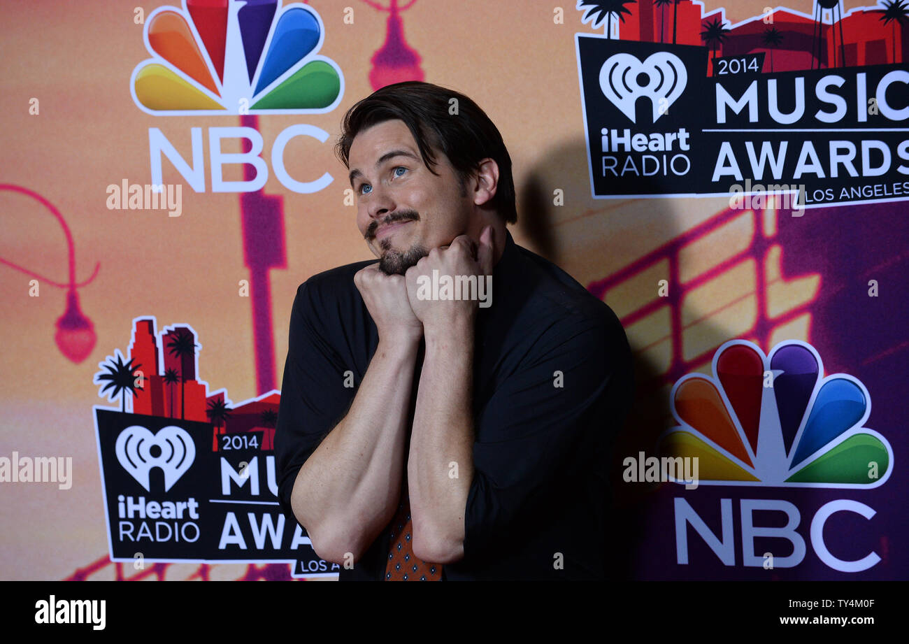 Presenter Jason Ritter poses backstage during the I Heart Radio Music ...