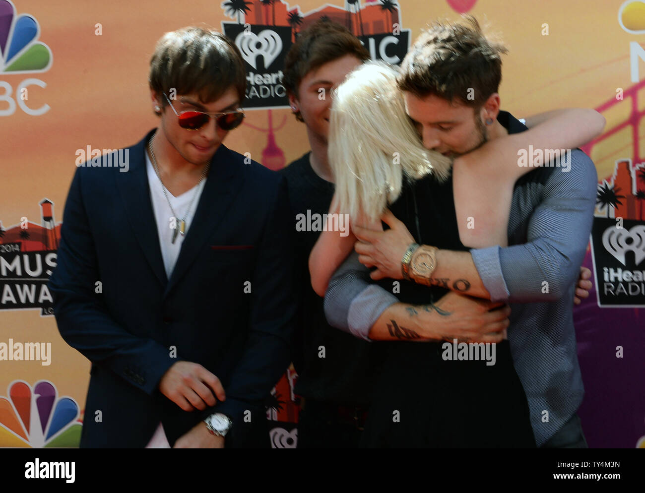 Bea hugs Em Three while attending the I Heart Radio Music Awards at the ...