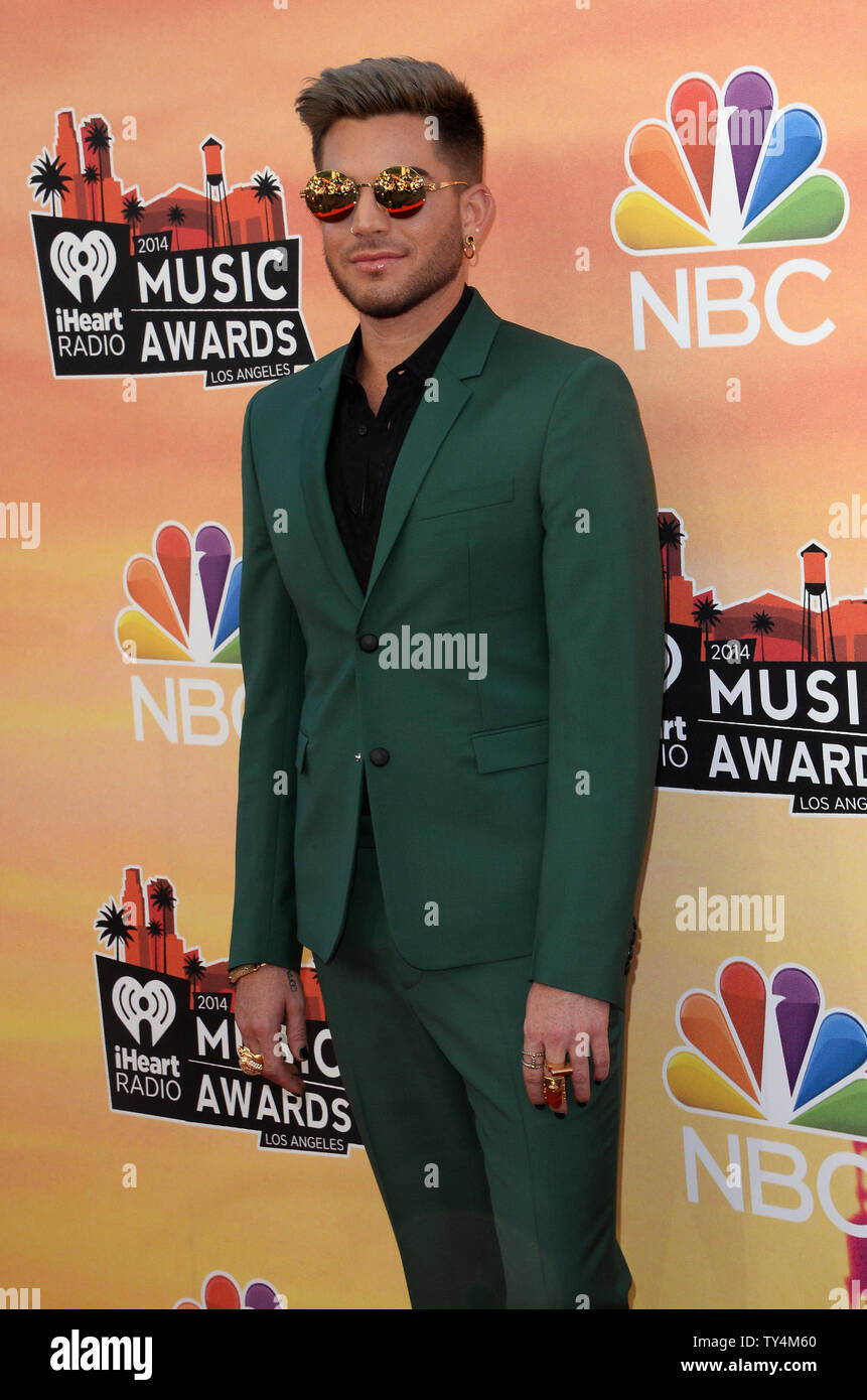 Stage actor and singer-songwriter Adam Lambert attends the I Heart ...